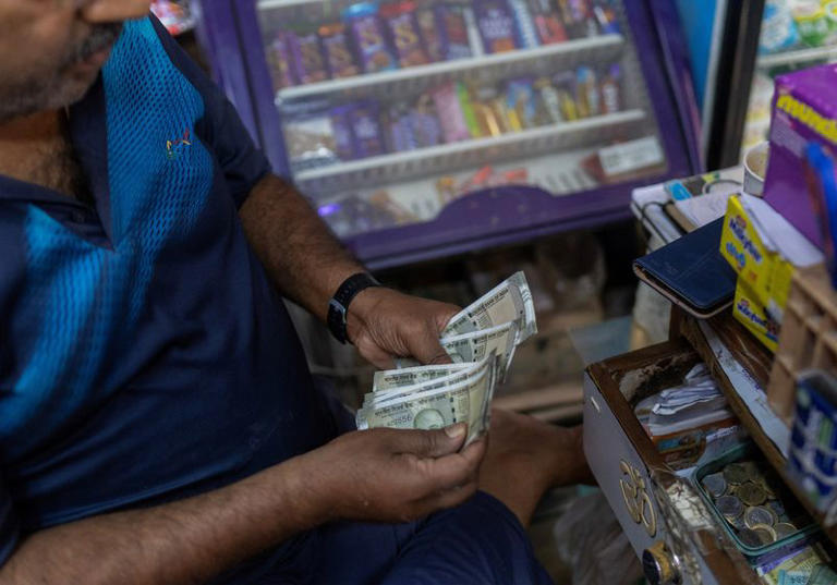 Rupee rebounds sharply on oil slide, NDF dollar selling