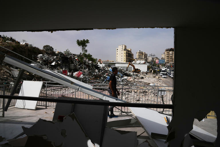 Israel demolishes dozens of Palestinian shops ahead of road project