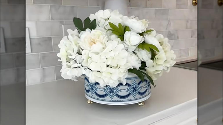 DIY a gorgeous piece of home decor out of a repurposed thrifted cookie tin