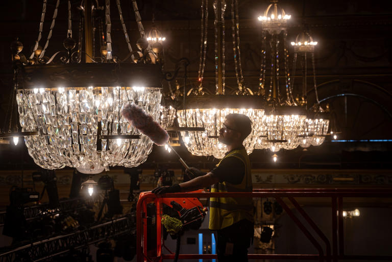 I clean the chandeliers at the Empress Ballroom and work high above ...