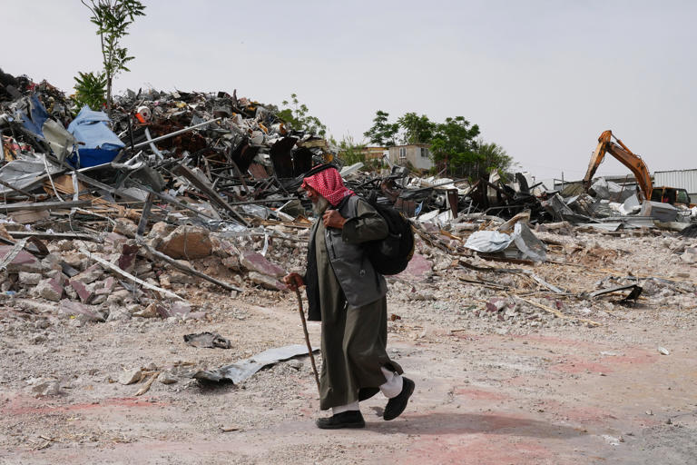 Israel demolishes dozens of Palestinian shops ahead of road project