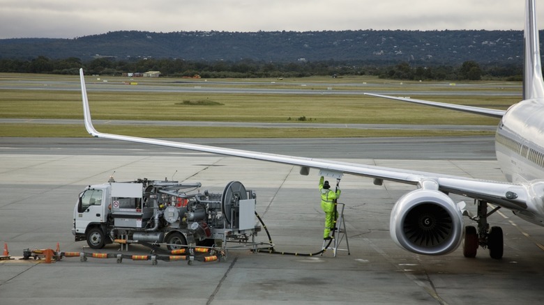 What kind of MPG does a commercial airplane get?