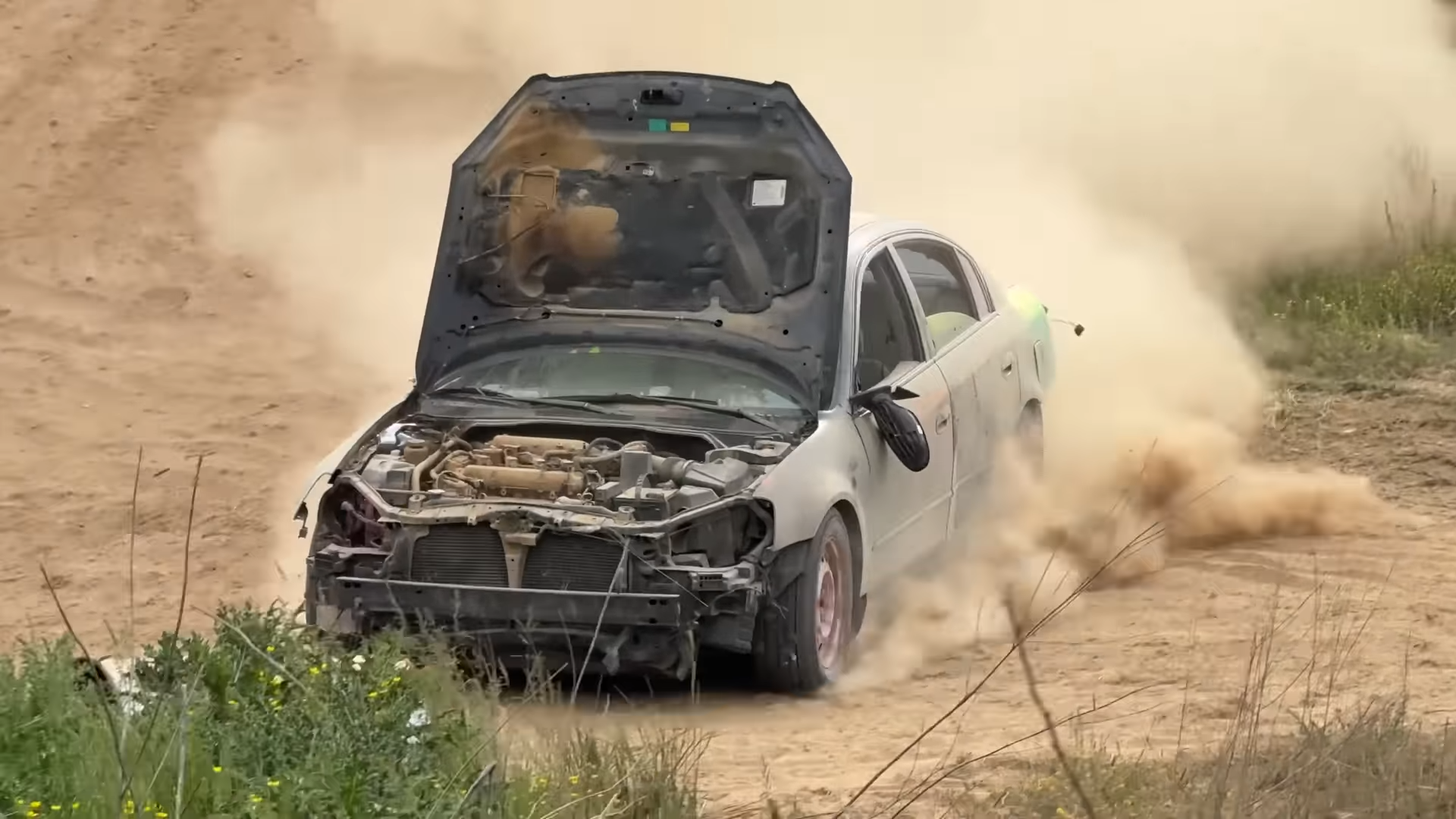 Driver loses control and crashes after hood flies open
