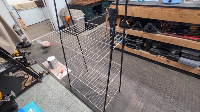 Man uses old oven racks to create a functional shelf unit on a budget