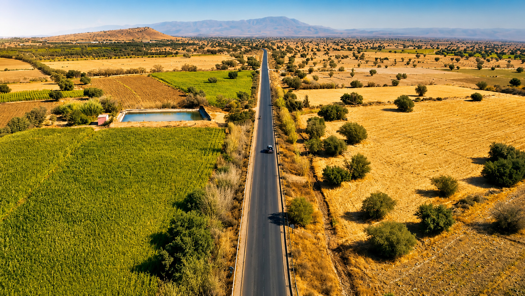 A lonely Moroccan road stretching toward the endless horizon