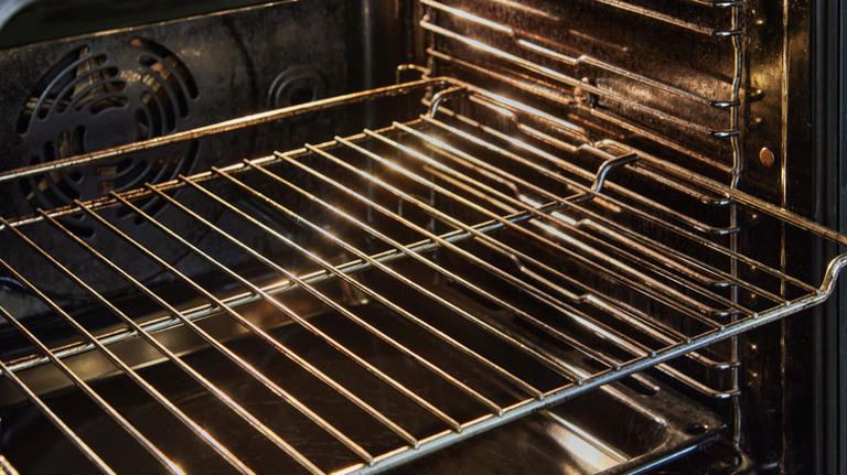 Man uses old oven racks to create a functional shelf unit on a budget