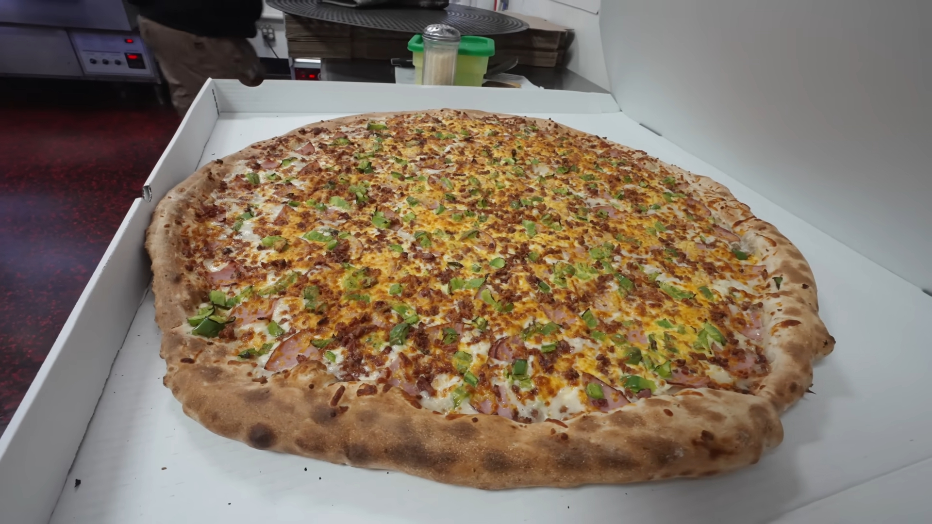 Taking on the 30 inch Gigantor breakfast pizza challenge