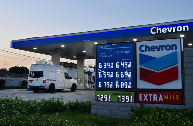 Soaring fuel costs draw attention to higher prices at name-brand gas ...