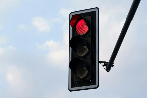 Should I go through a red light if an ambulance or fire engine is ...