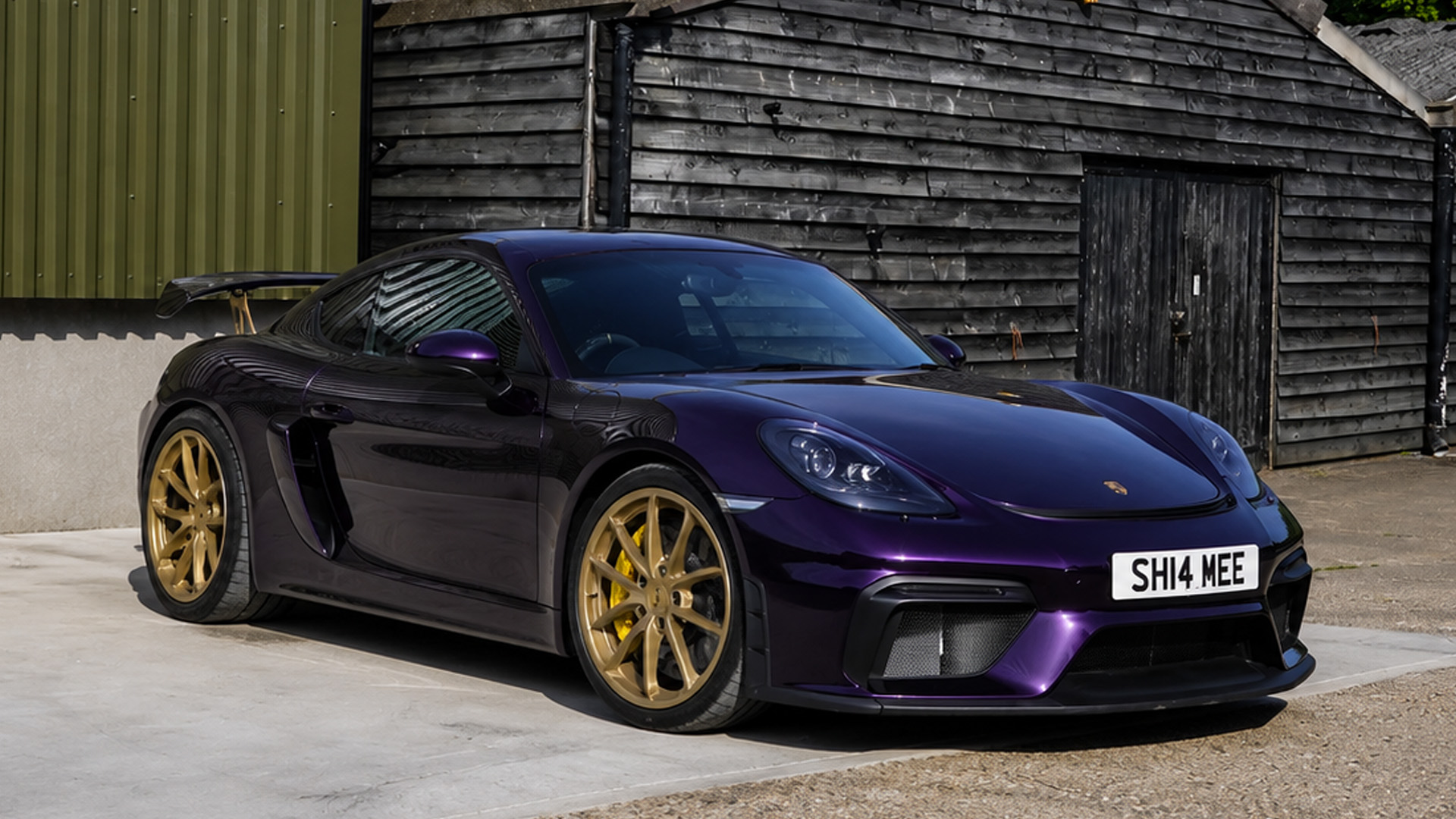 Porsche 718 GT4 in midnight purple with gold wheels