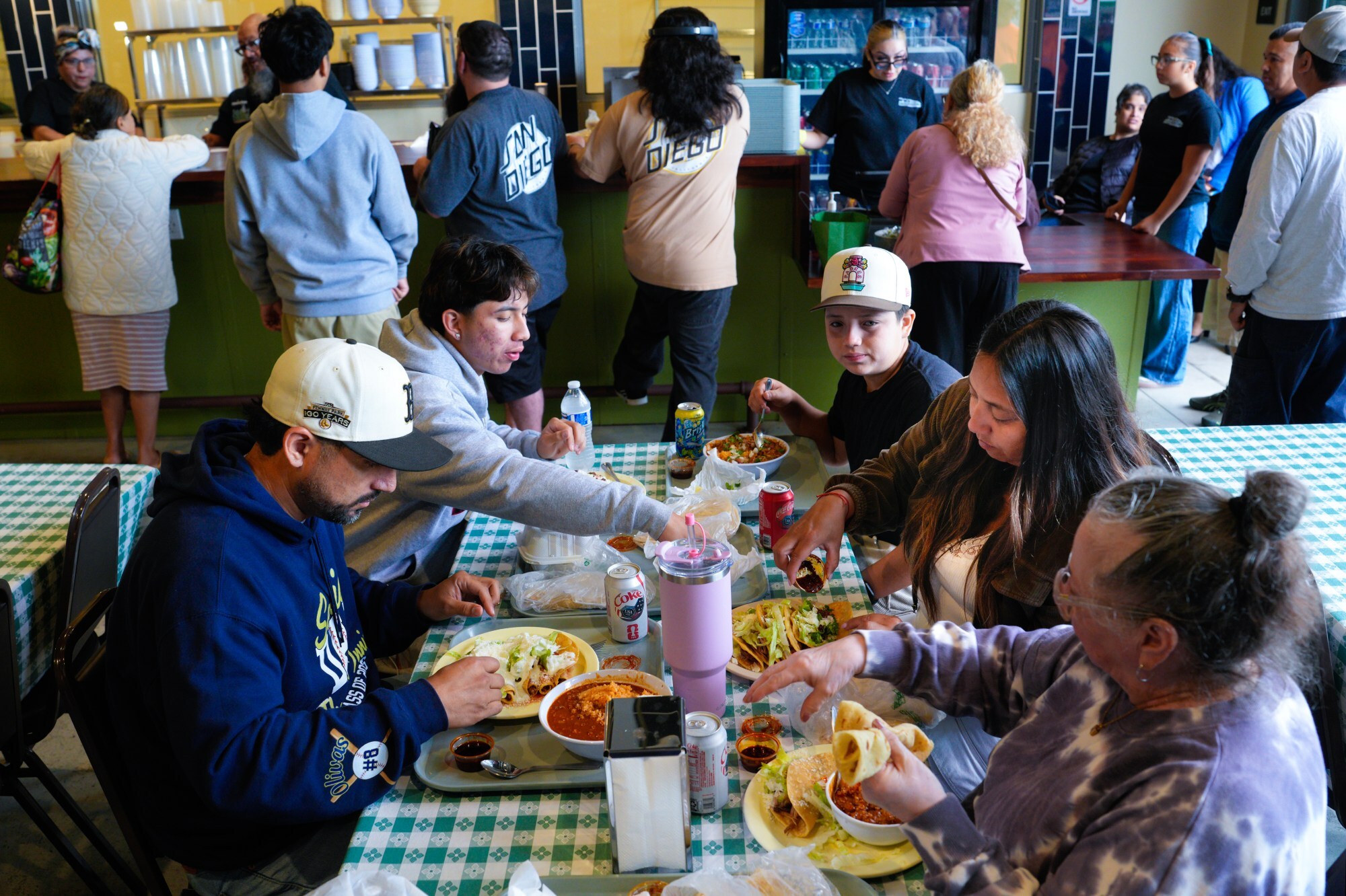 Las Cuatro Milpas customers start lining up at 3 a.m. for the grand ...