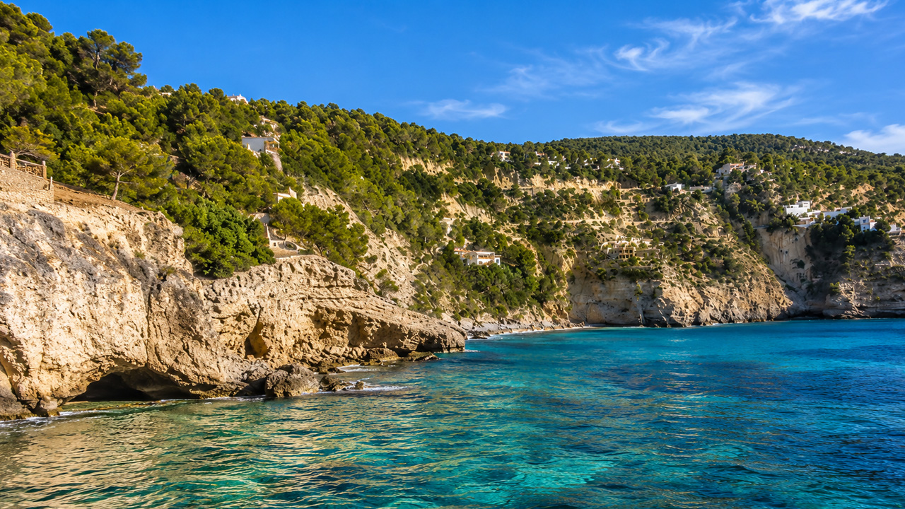 Where clear blue water meets Ibiza’s rocky shoreline