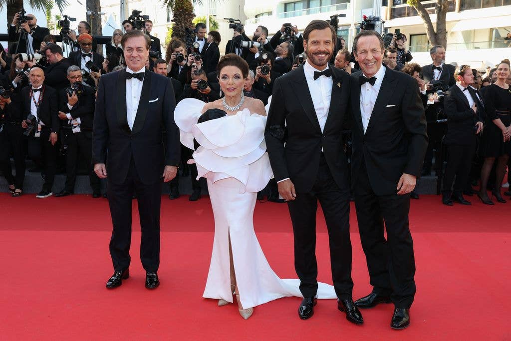 Joan Collins, 92, steals the show in breathtaking gown on the Cannes ...