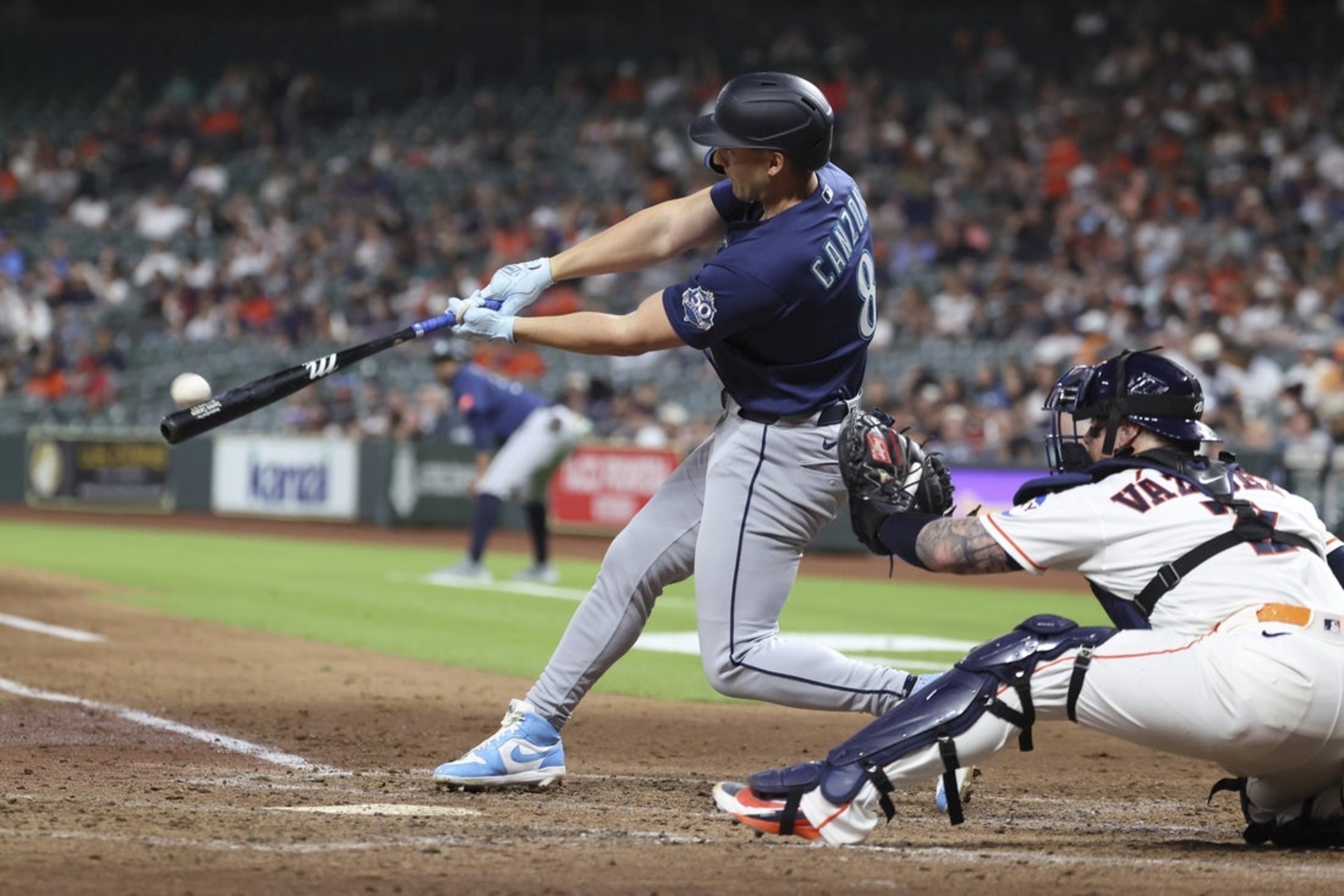 Dominic Canzone's slam backs Bryan Woo as M's rout Astros