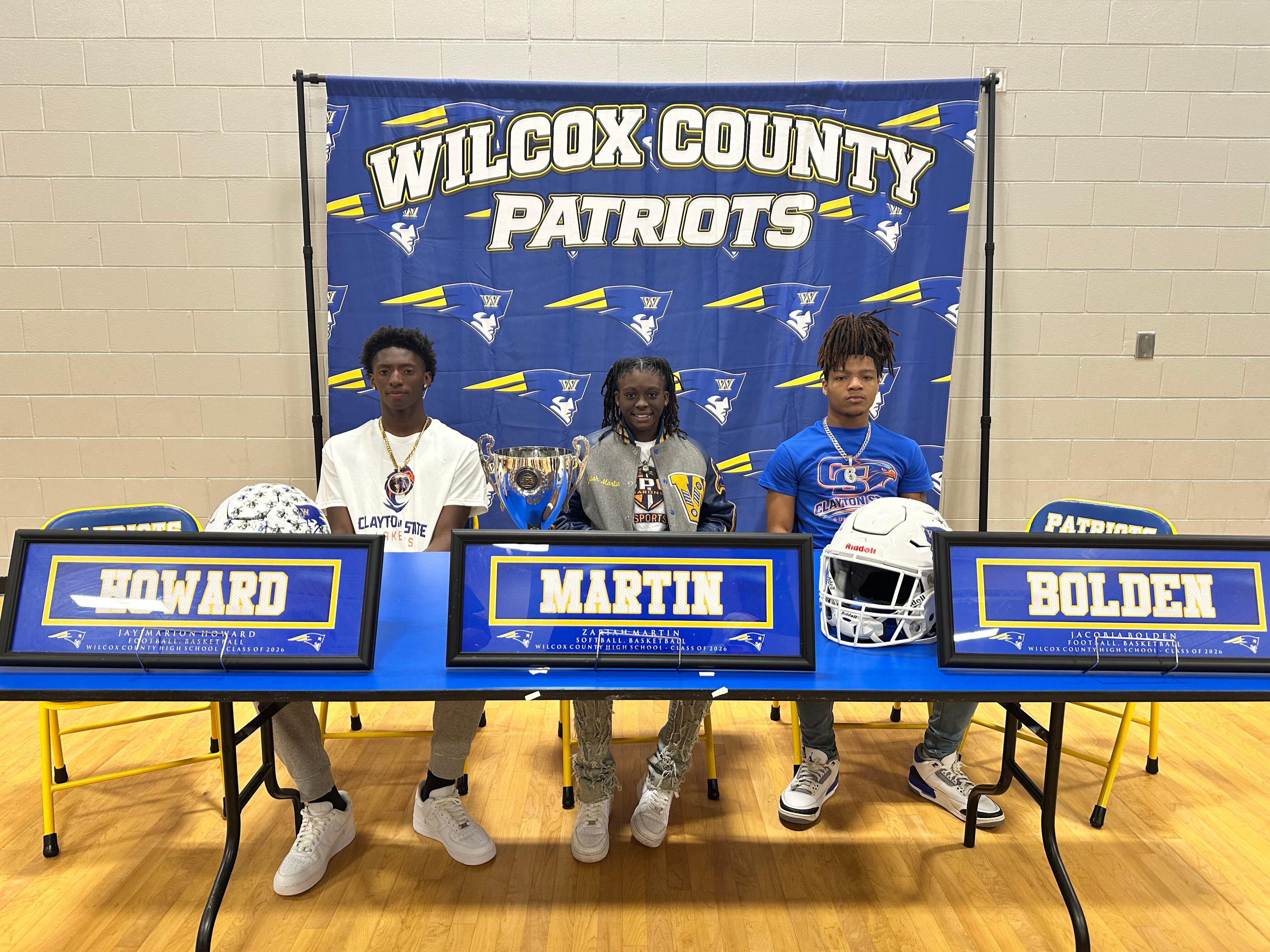Wilcox County celebrates three student-athletes signing to play in college