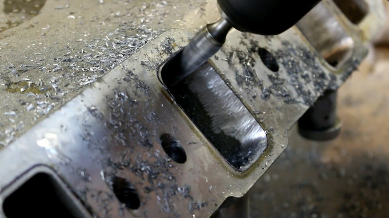 What does porting an intake manifold do for engine performance?