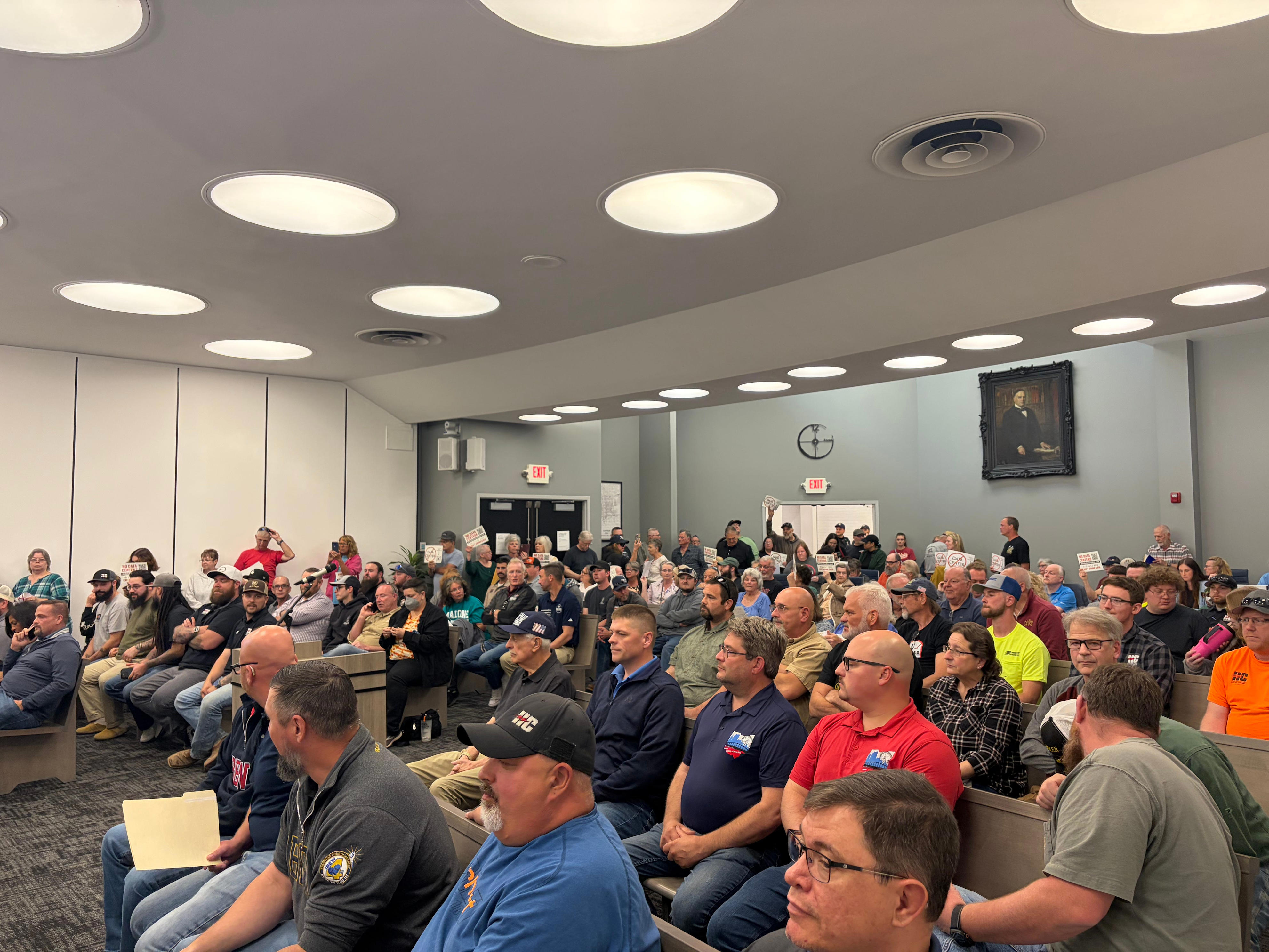 Packed room, emotional debate as Canton weighs data center proposal