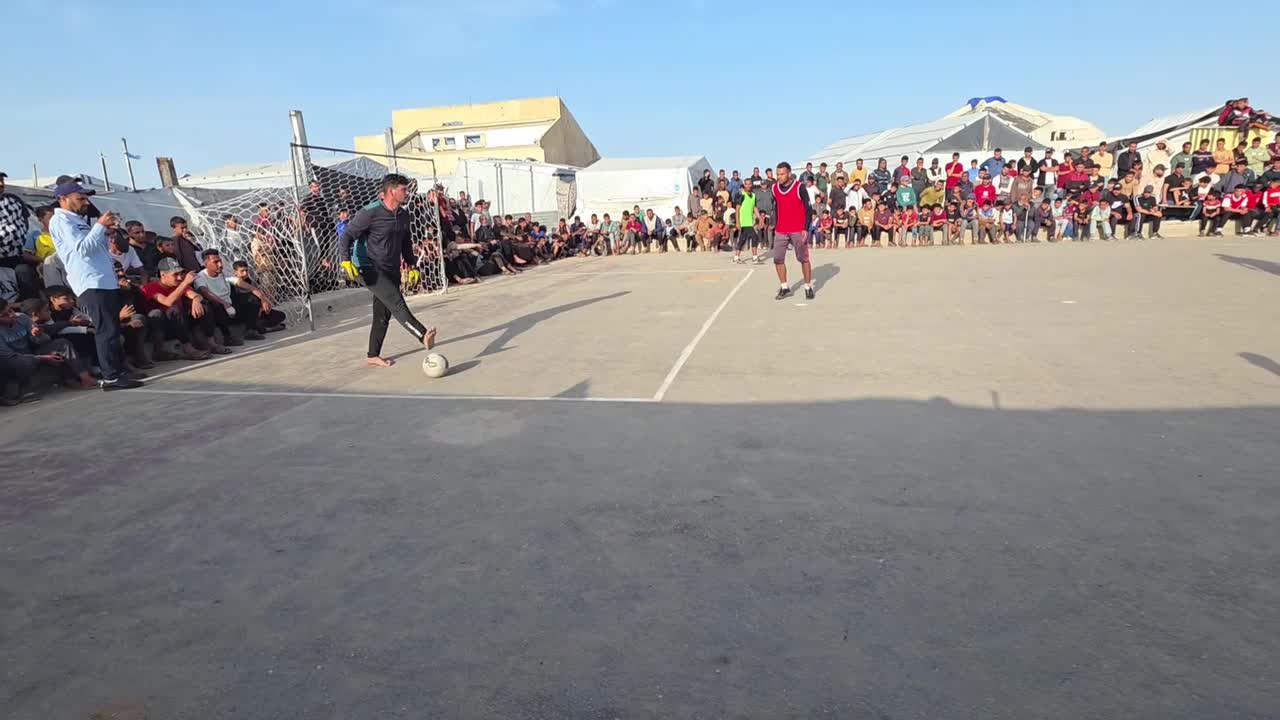 Young Palestinians play football tournament inside displacement camps ...
