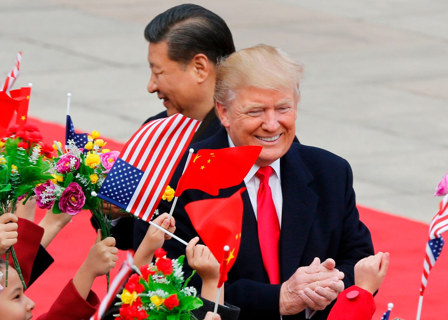 Trump arrives in China for summit as war and inflation weigh on presidency