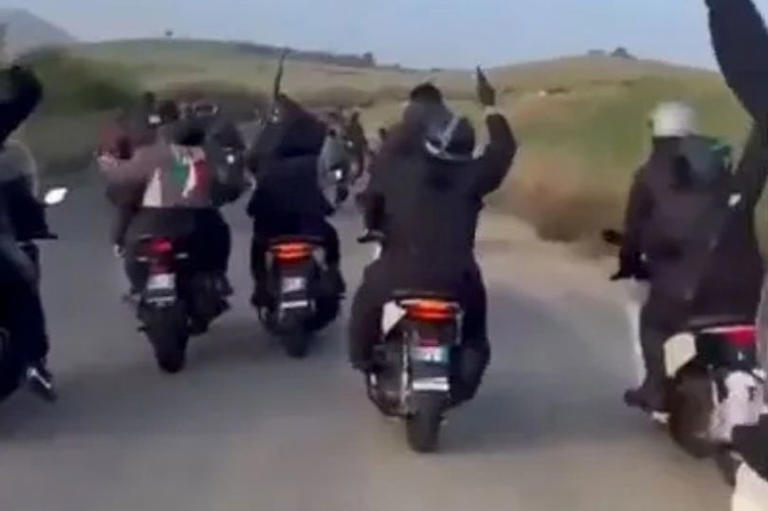Mafia goons fire AK-47s from scooters in sick horse racing video