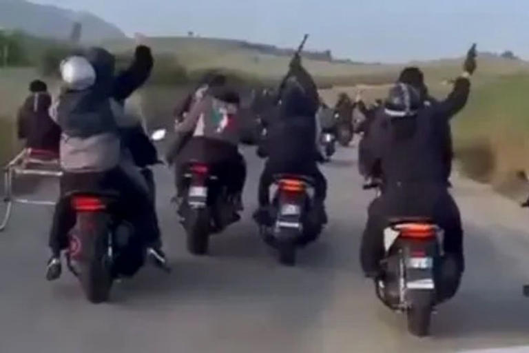 Mafia goons fire AK-47s from scooters in sick horse racing video