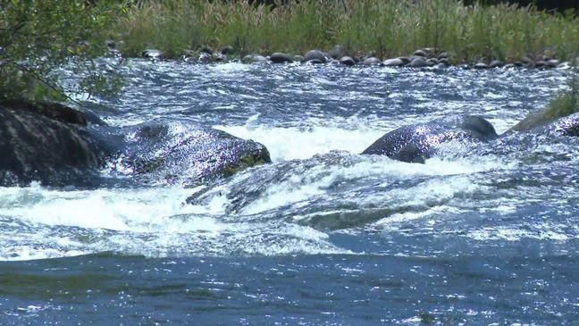 Why do people enter the Kern River despite warnings?