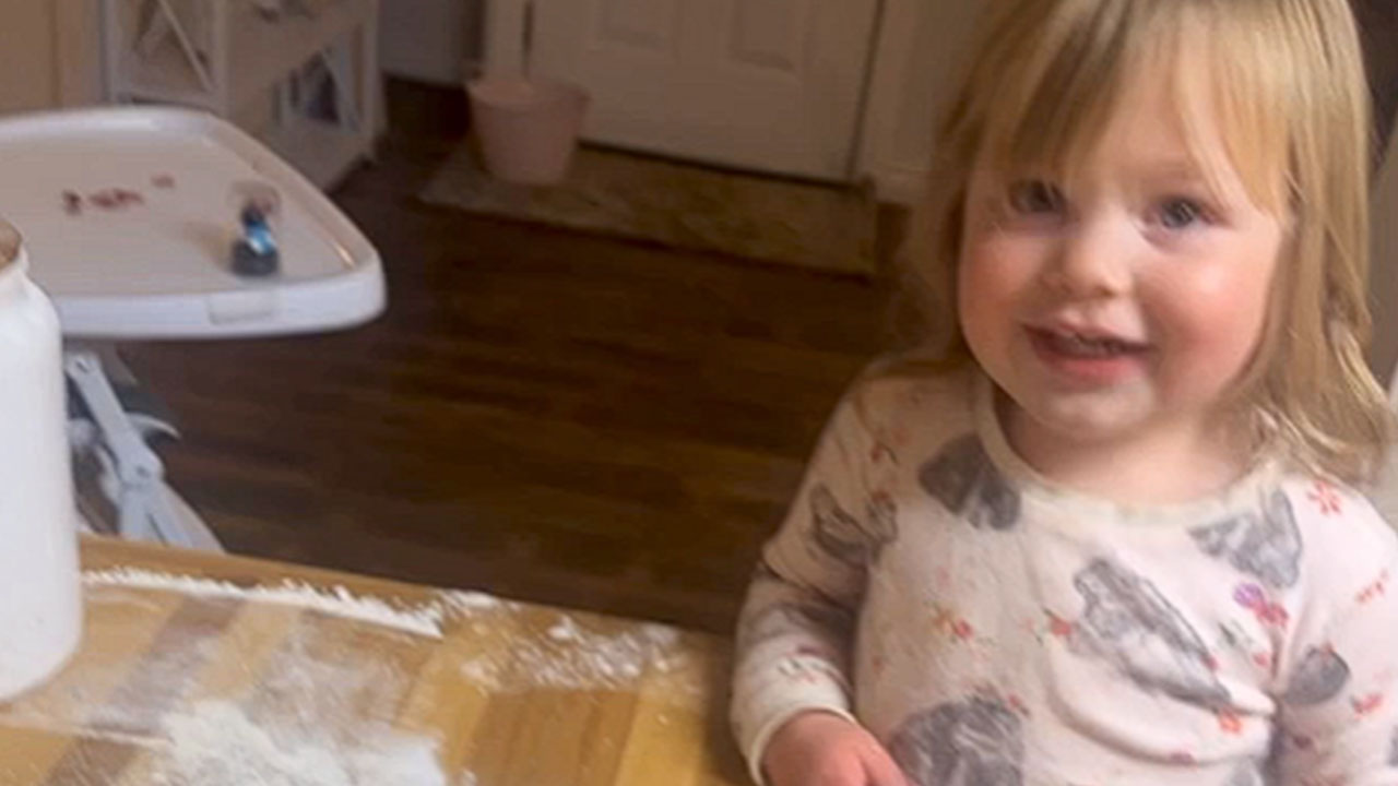 1 Y/O girl cracks egg like a pro while making pasta with dad