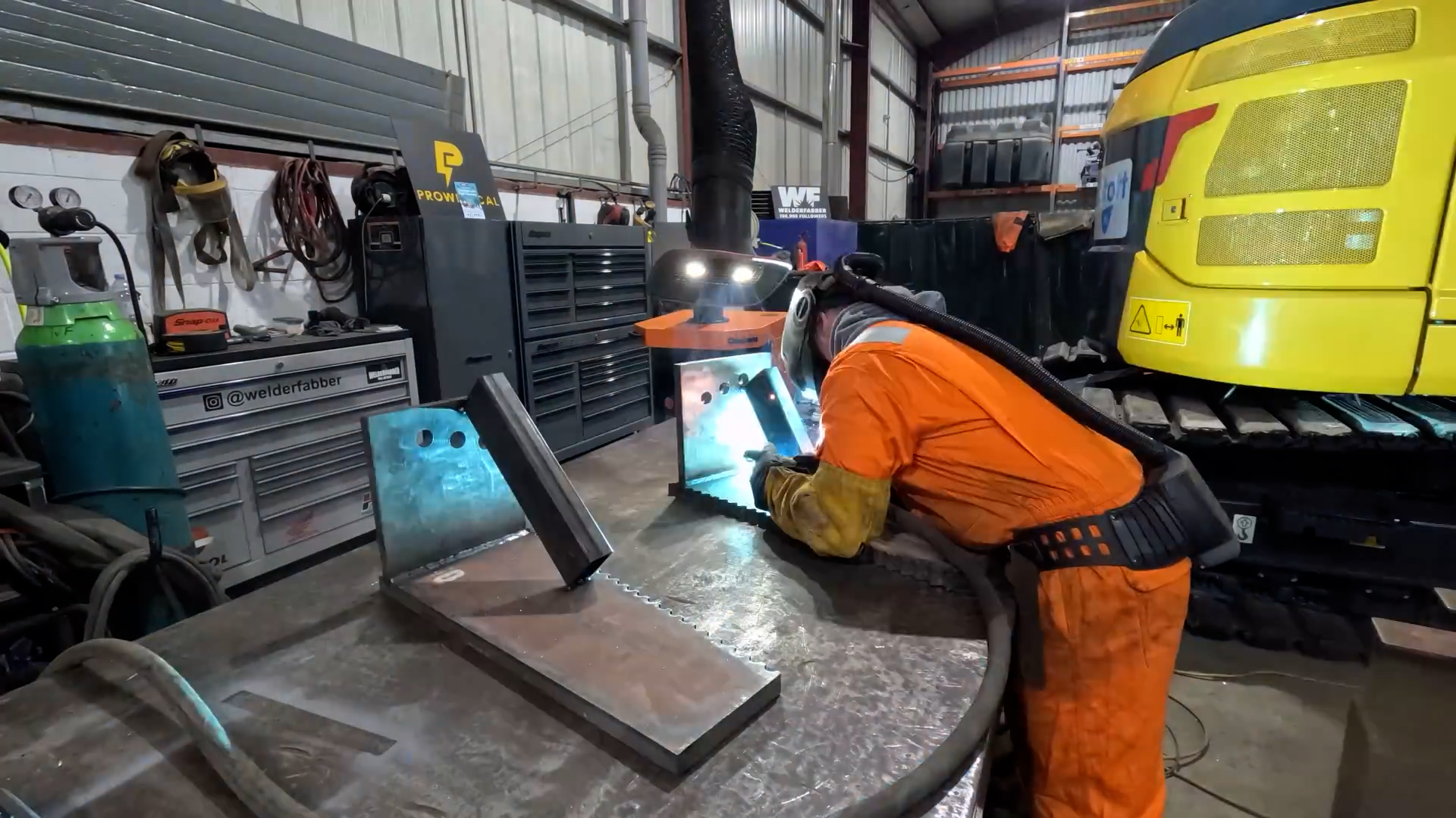 Heavy equipment fabrication and precision MIG welding in workshop