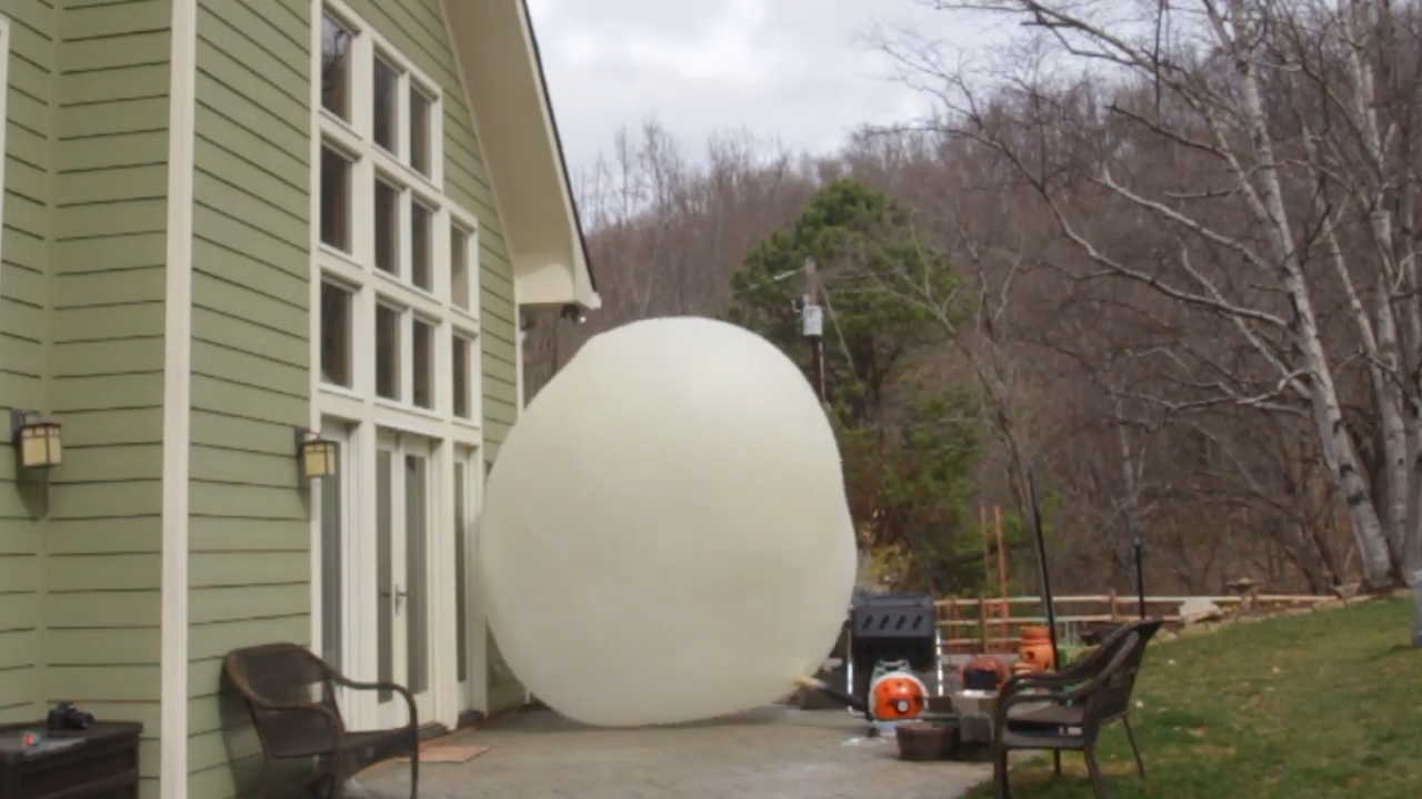 He filled a giant balloon and then slow motion caught everything