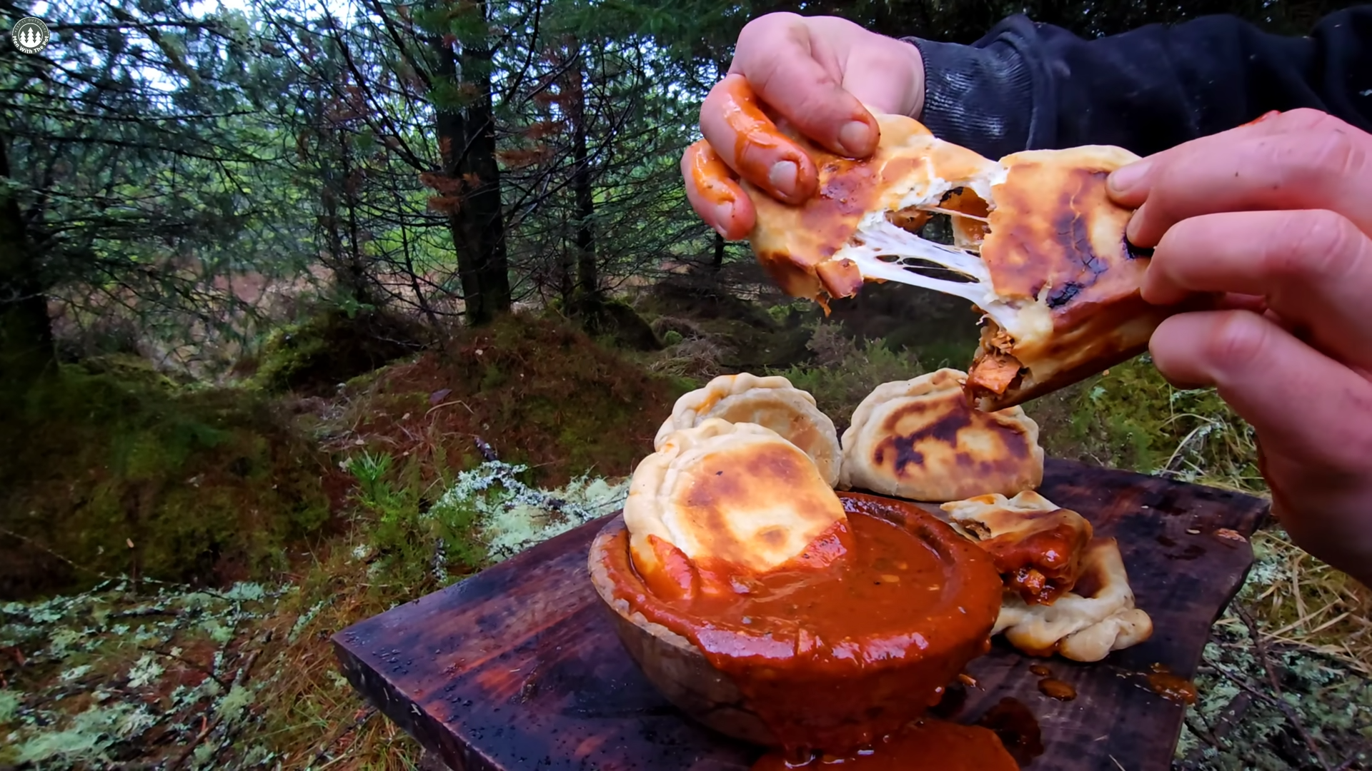 Primitive BBQ chicken dumplings on hot stone (rainy day)