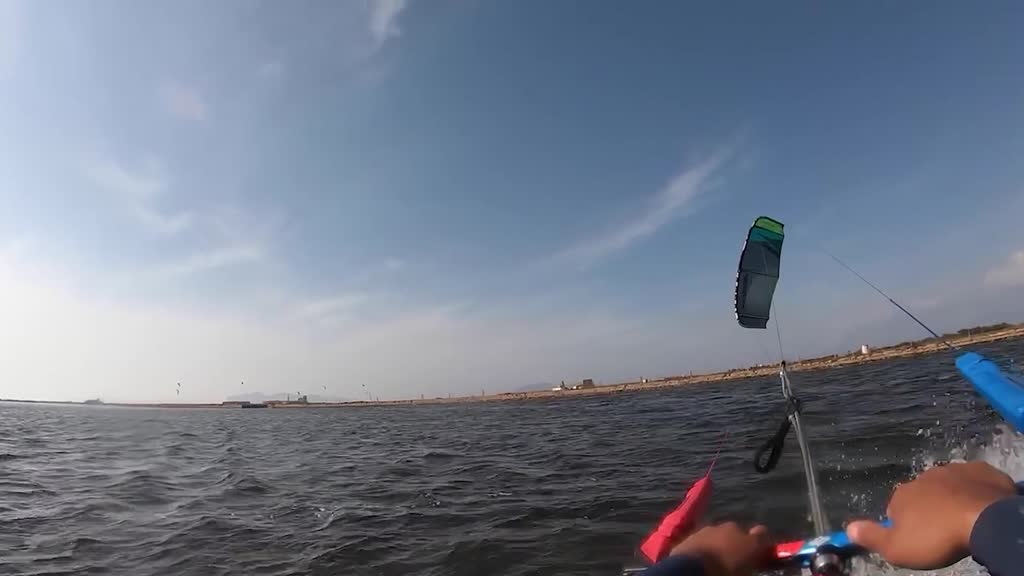 Kite surfer crashes into sea wall rocks