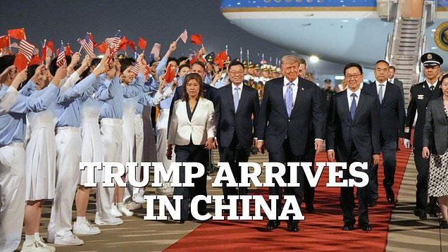Trump arrives in China with smiles and fist pumps