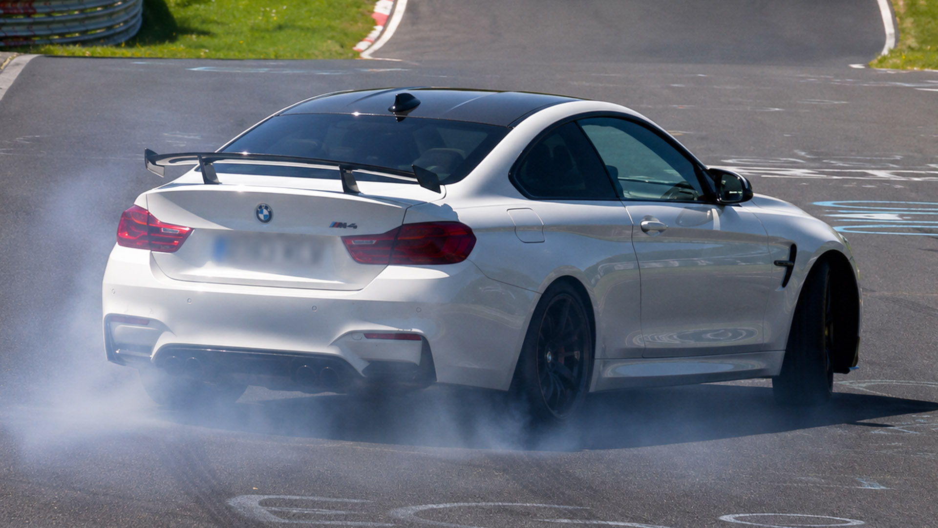 High speed corner exit turns into smoky Nürburgring moment