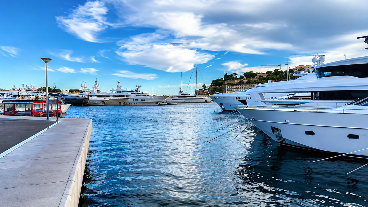 Monte Carlo harbor walk among superyachts and blue water