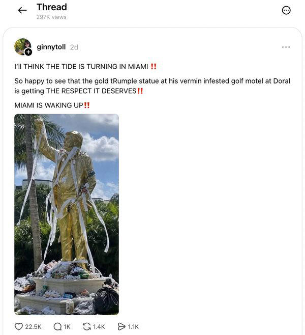 Was golden Trump statue vandalized with garbage, as shown in image?