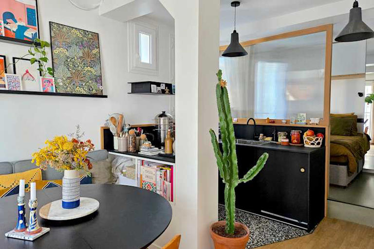 A glass partition turns a 270-square-foot studio into a proper one bedroom