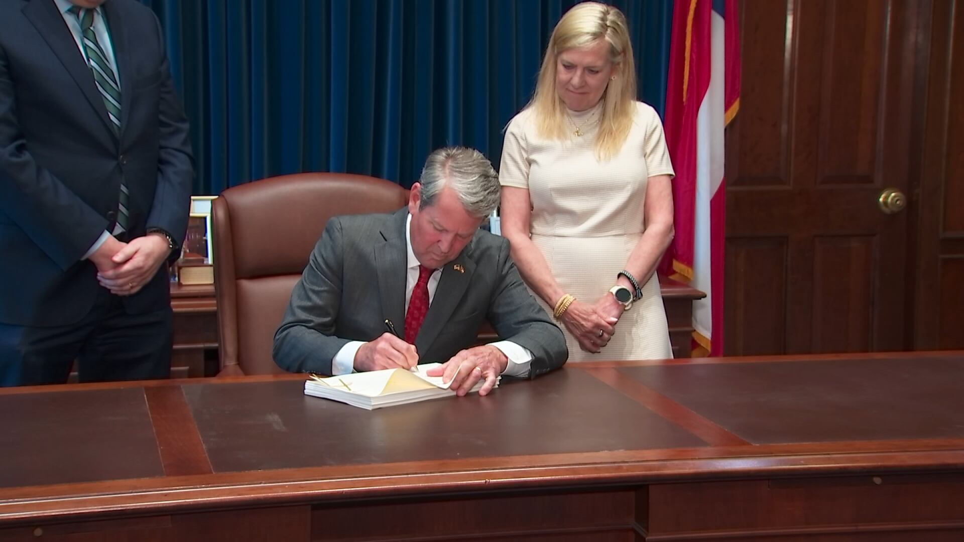 In signing budget, Kemp freezes more than $300M in new spending