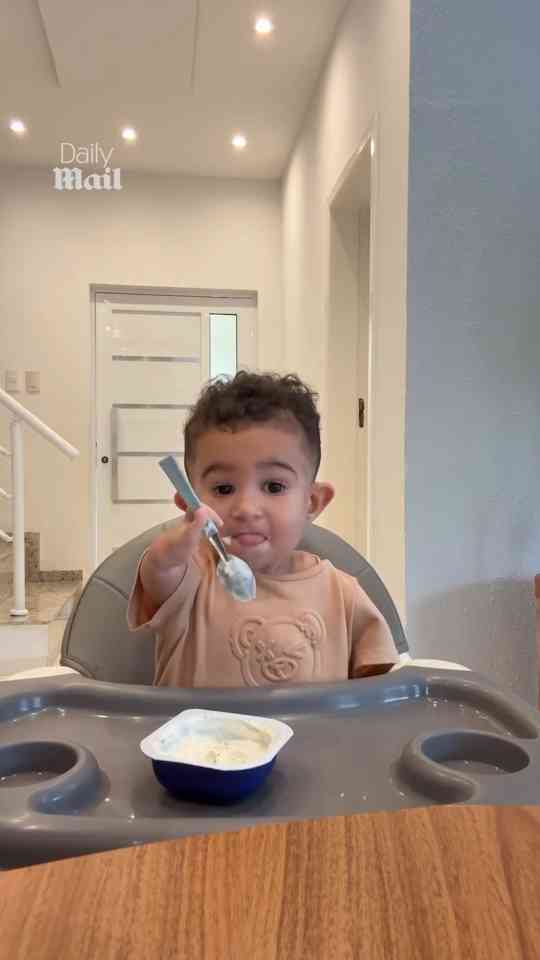 Dad helps son overcome frustration in touching mealtime moment