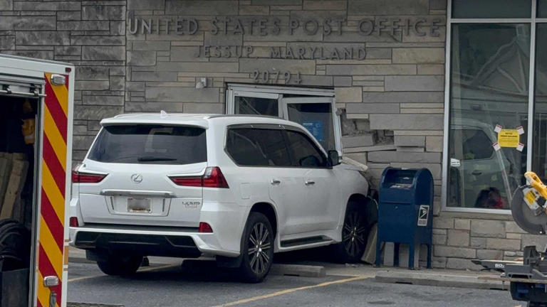 Post office evacuated after SUV crashes into building