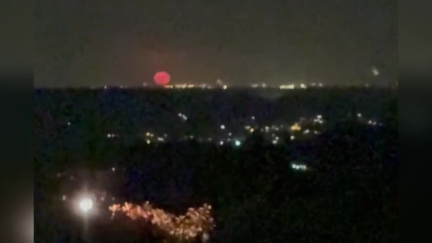 Behind Milan, a red moon: photographer Valerio Minato captures the ...