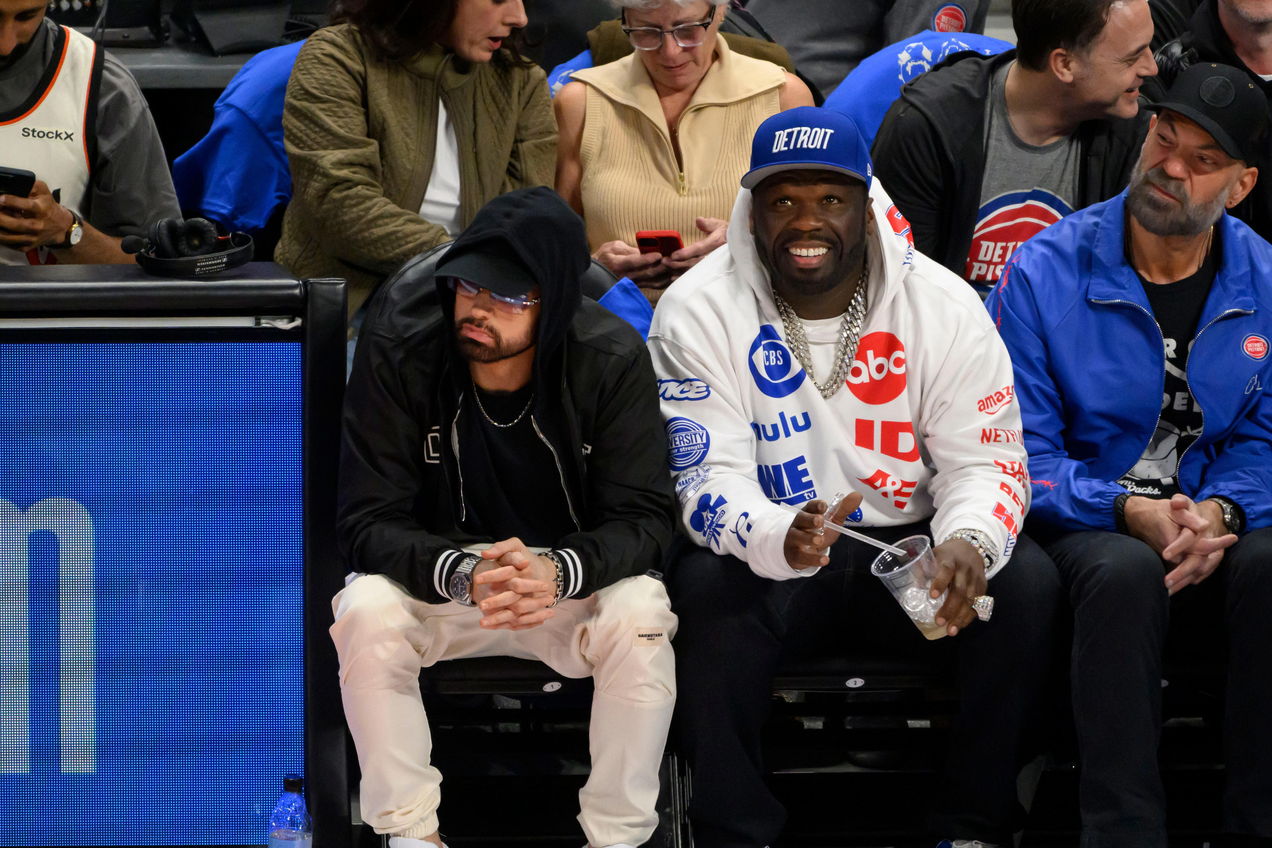 Eminem brings fellow rapper 50 Cent to Pistons game