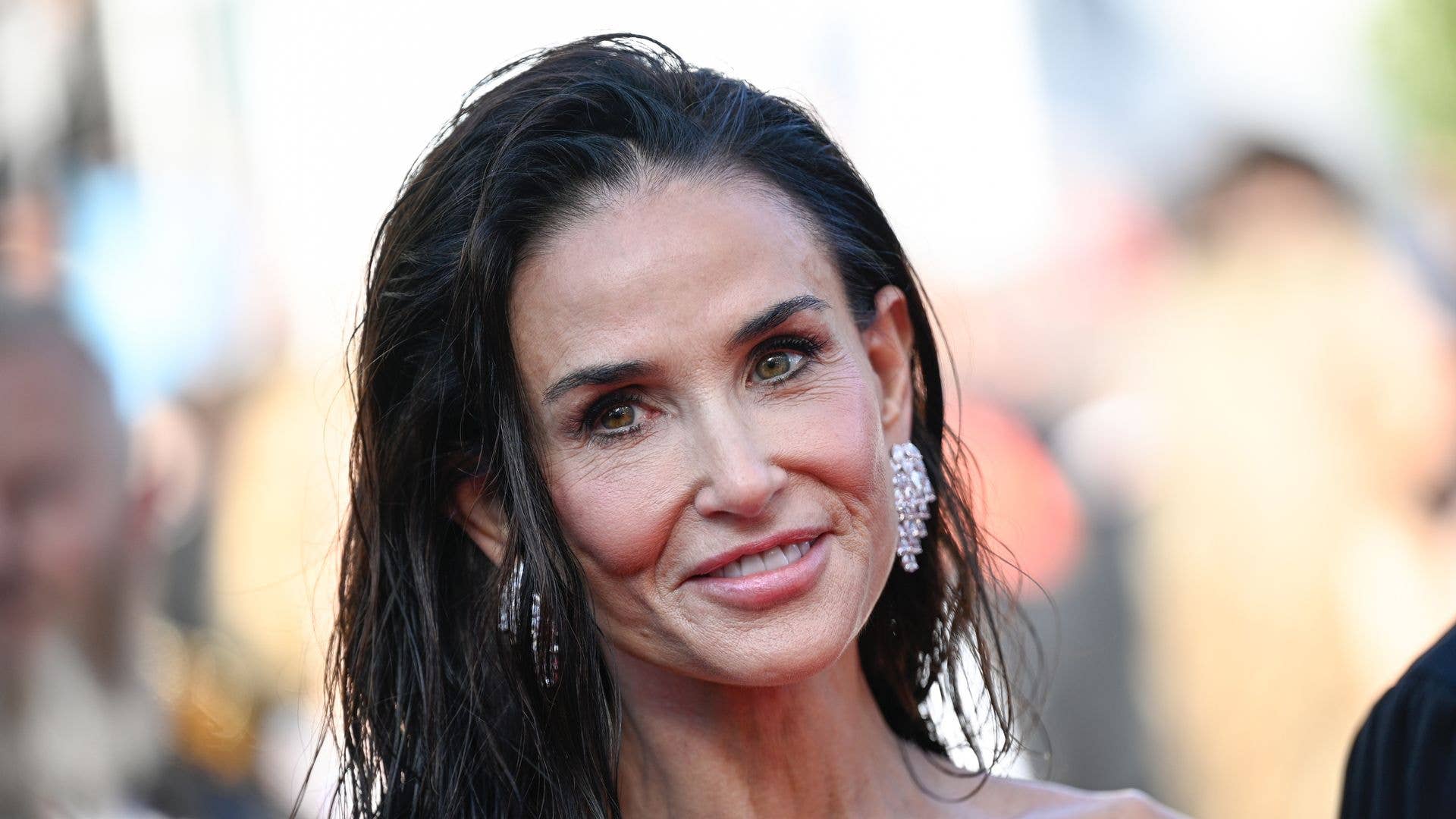 Demi Moore, 63, steals the show in glorious purple dress with long ...