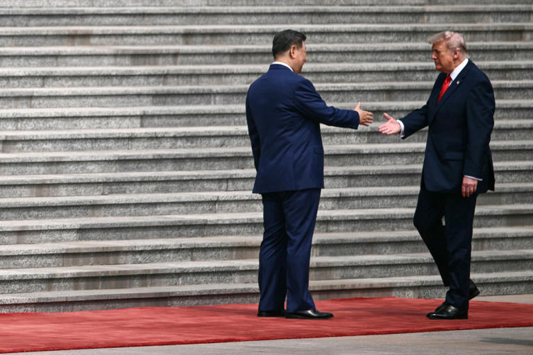 Trump, Xi Jinping shake hands at Beijing’s Great Hall of the People