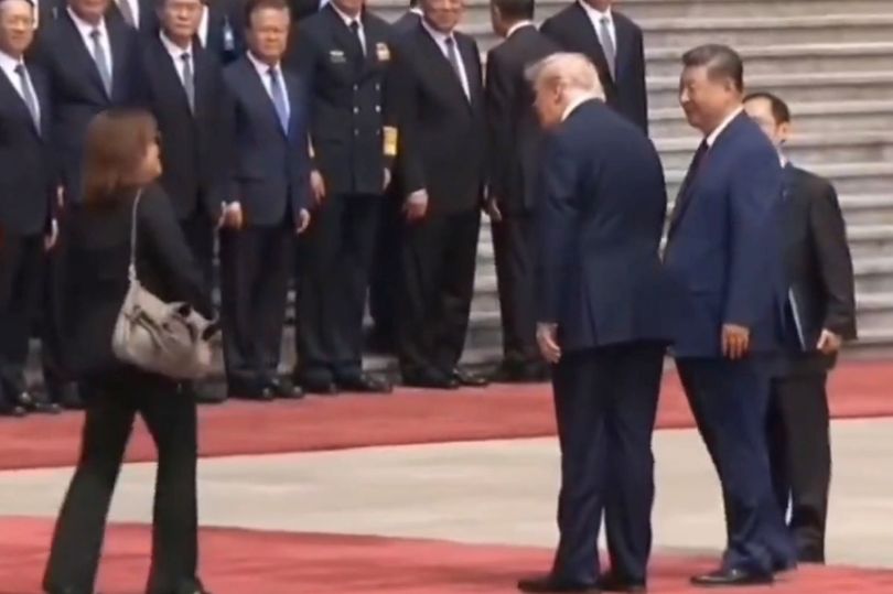 Trump in China stops and glares at interpreter as she interrupts him ...