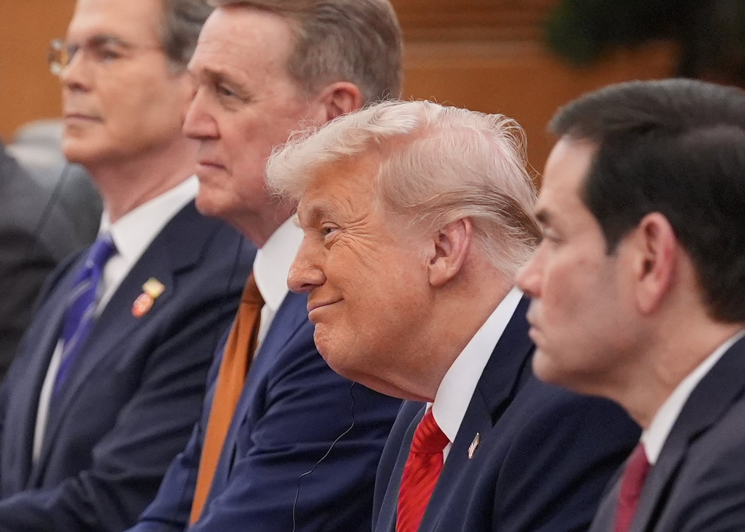 Trump offers friendly words in Beijing while Xi issues cautionary warning