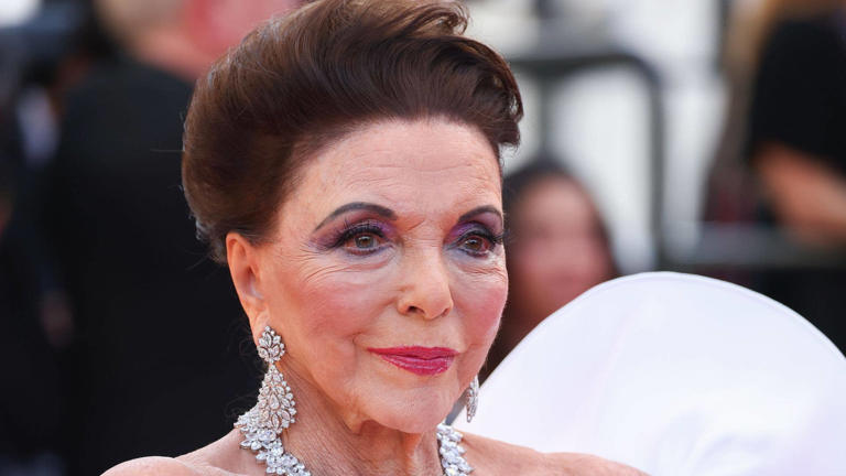 Joan Collins steals the show in breathtaking gown on the Cannes red carpet