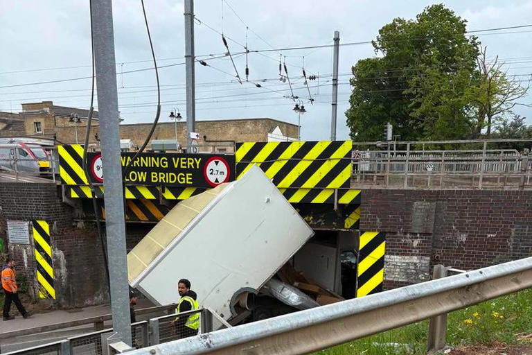 Van crashes into Cambridgeshire railway bridge causing delays