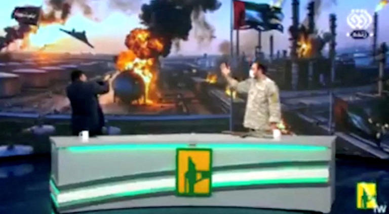 Moment Iranian TV news anchor fires assault rifle on live television ...