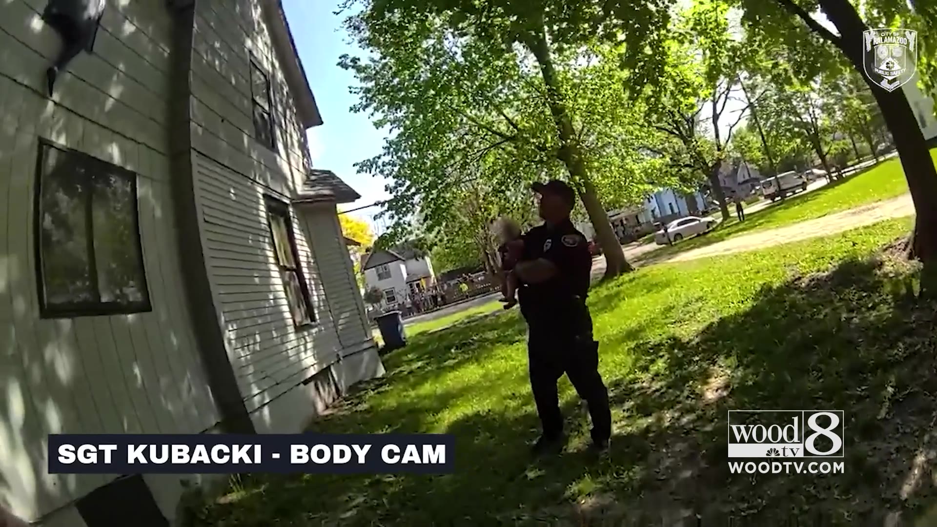 Bodycam: KDPS officer catches baby at house fire