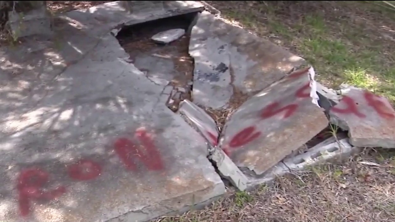 Vandalized graveyard cleanup